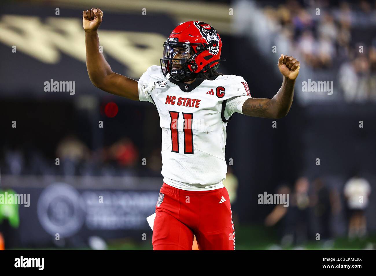 September 11,2025: NC State quarterback CJ Bailey (11) goes into fourth ...