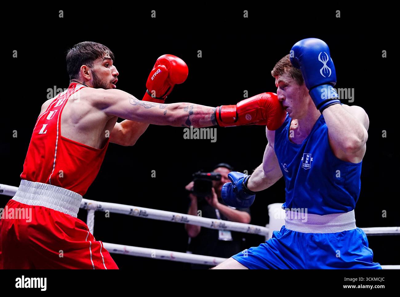 Rami Kiwan (red) of Bulgaria in action against Callum Makin (blue) of ...