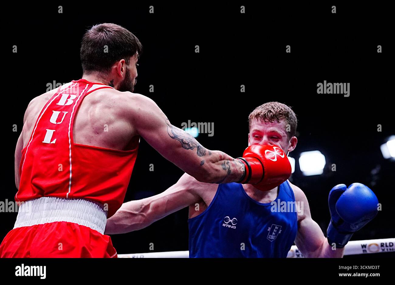 Rami Kiwan (red) of Bulgaria in action against Callum Makin (blue) of ...