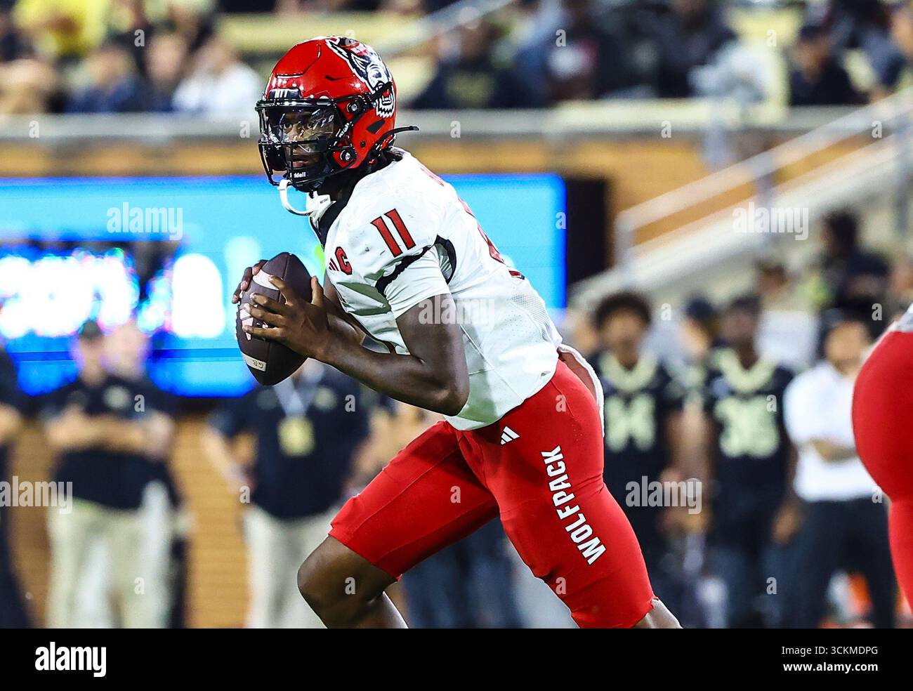 September 11,2025: NC State quarterback CJ Bailey (11) scrambles. NCAA ...
