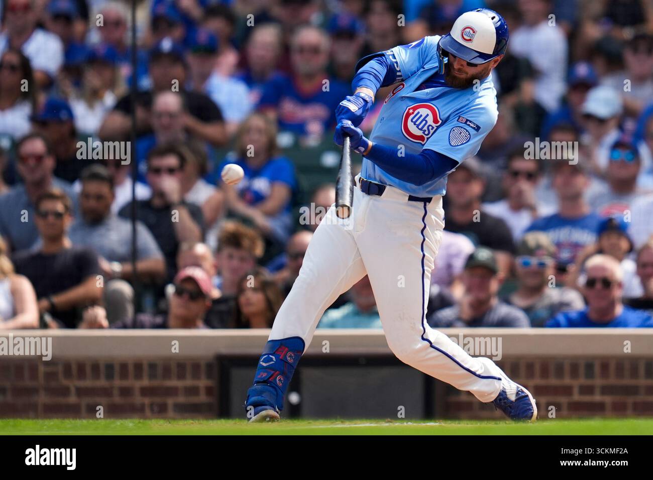 Chicago Cubs' Michael Busch (29) hits a one-run single during the ...