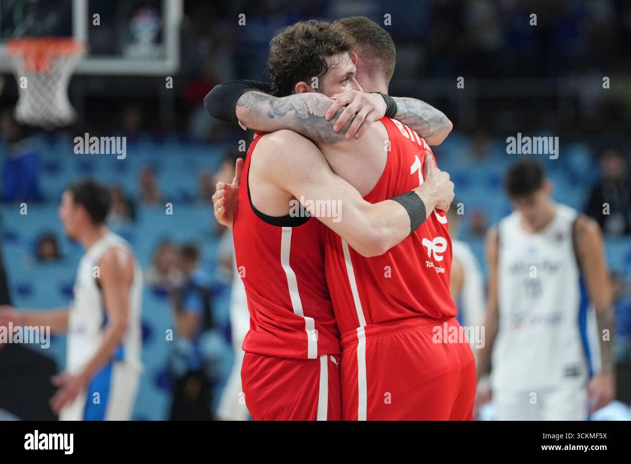 Turkey's Sehmus Hazer, left, and Turkey's Onuralp Bitim celebrate after ...
