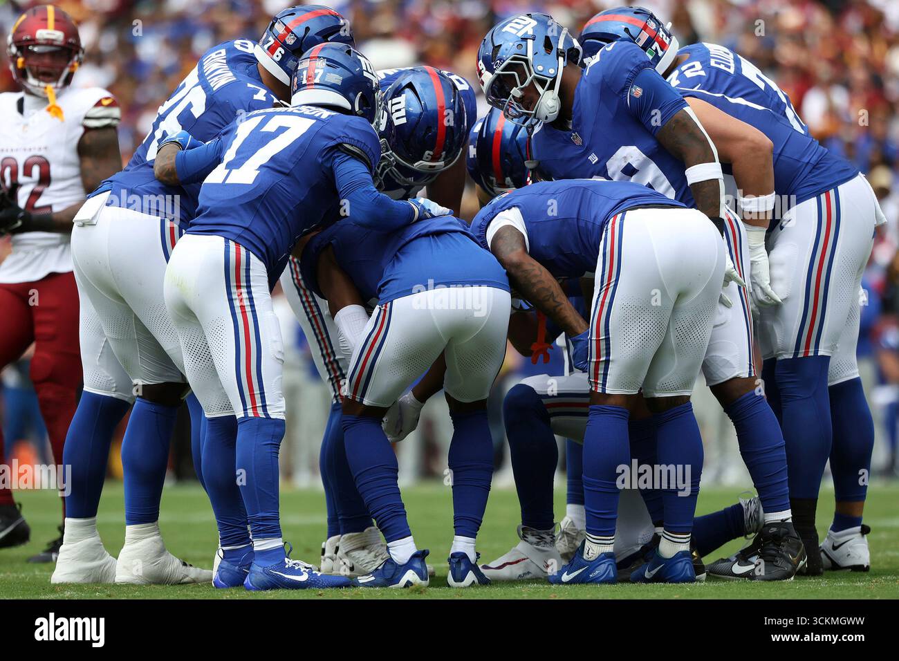 New York Giants players huddle up during an NFL football game against ...