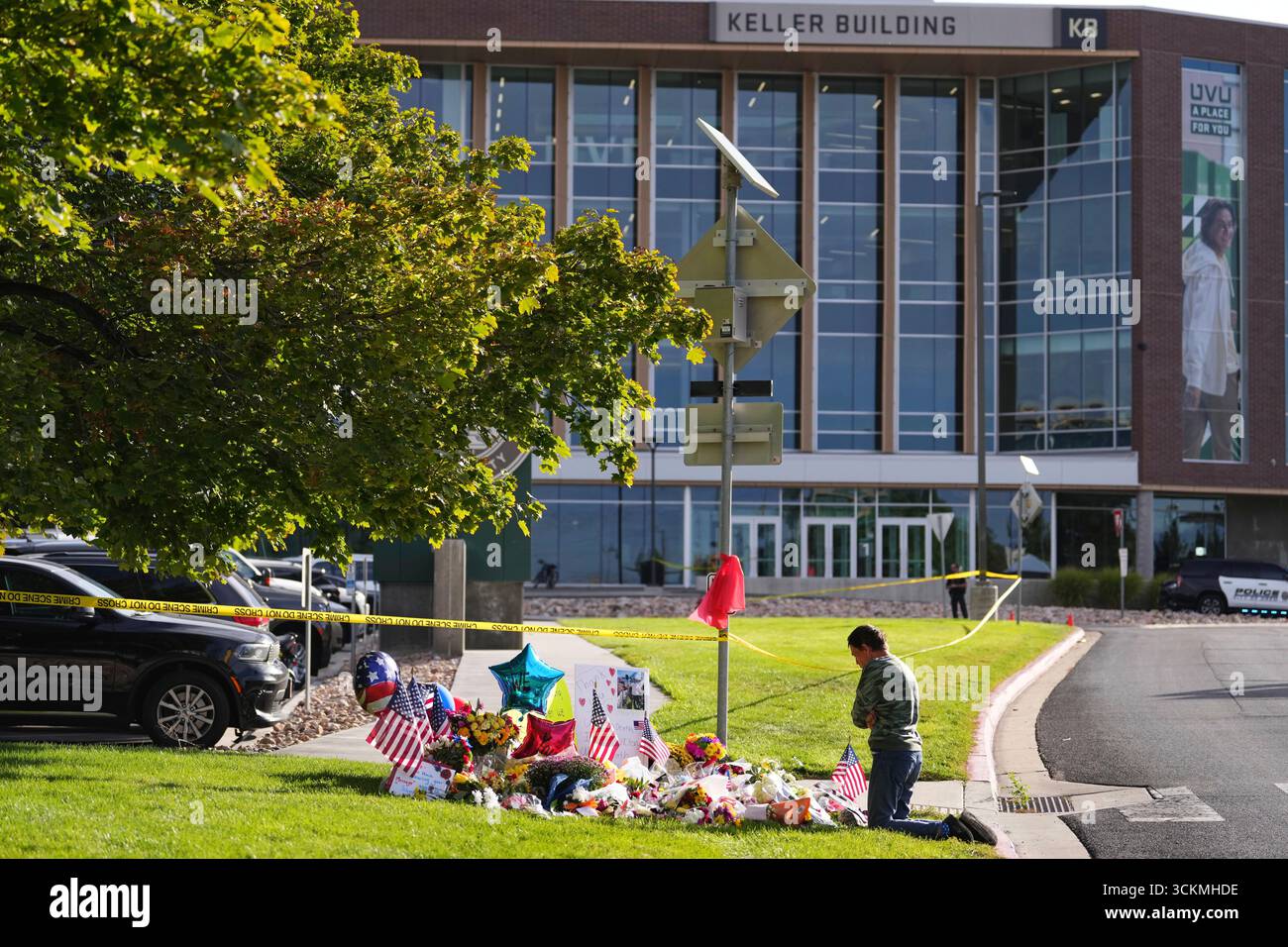 Wendy Lucas, a student at Utah Valley University, kneels at a growing ...