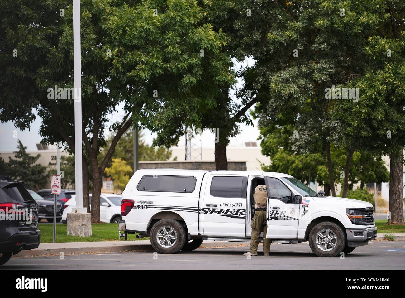 A Utah County Sheriff gets out of their vehicle at the Utah County ...