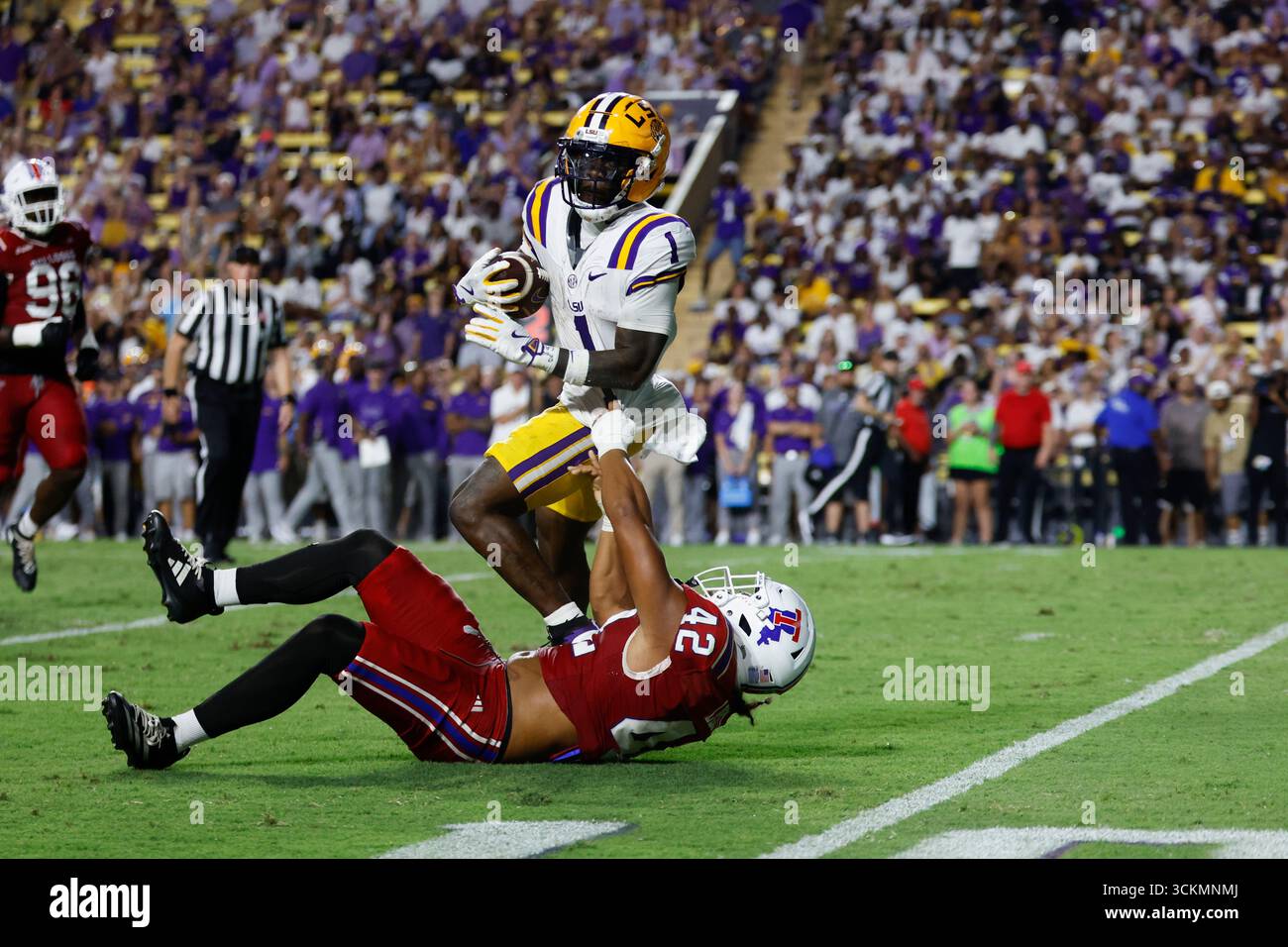 LSU wide receiver Aaron Anderson (1) carries the ball as Sifa Leota (42 ...