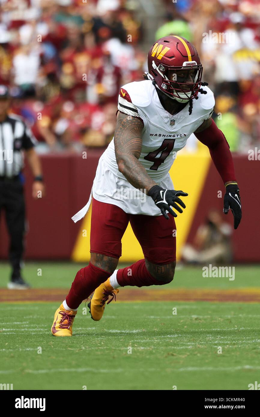 Washington Commanders linebacker Frankie Luvu (4) rushes during an NFL ...