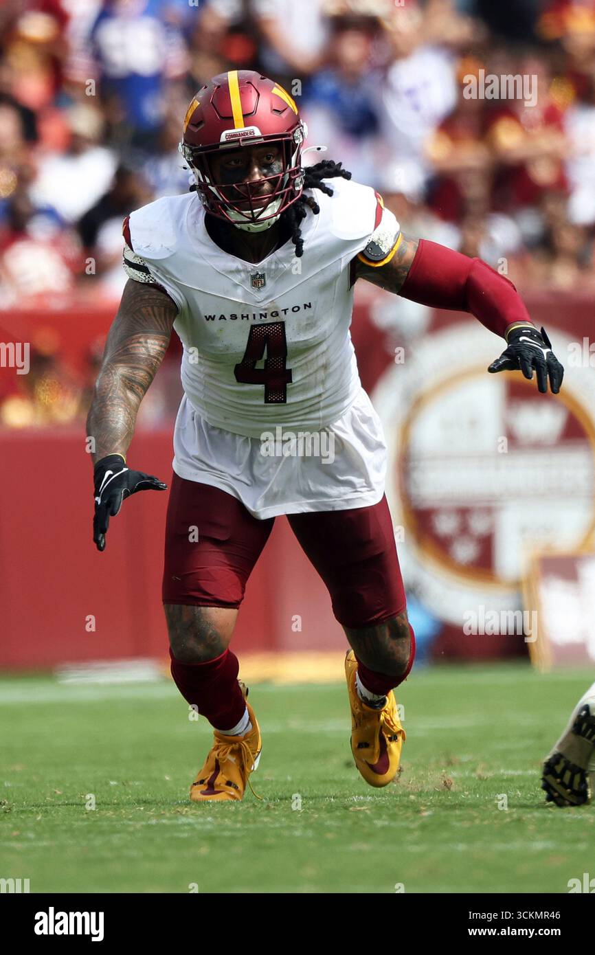 Washington Commanders linebacker Frankie Luvu (4) rushes during an NFL ...