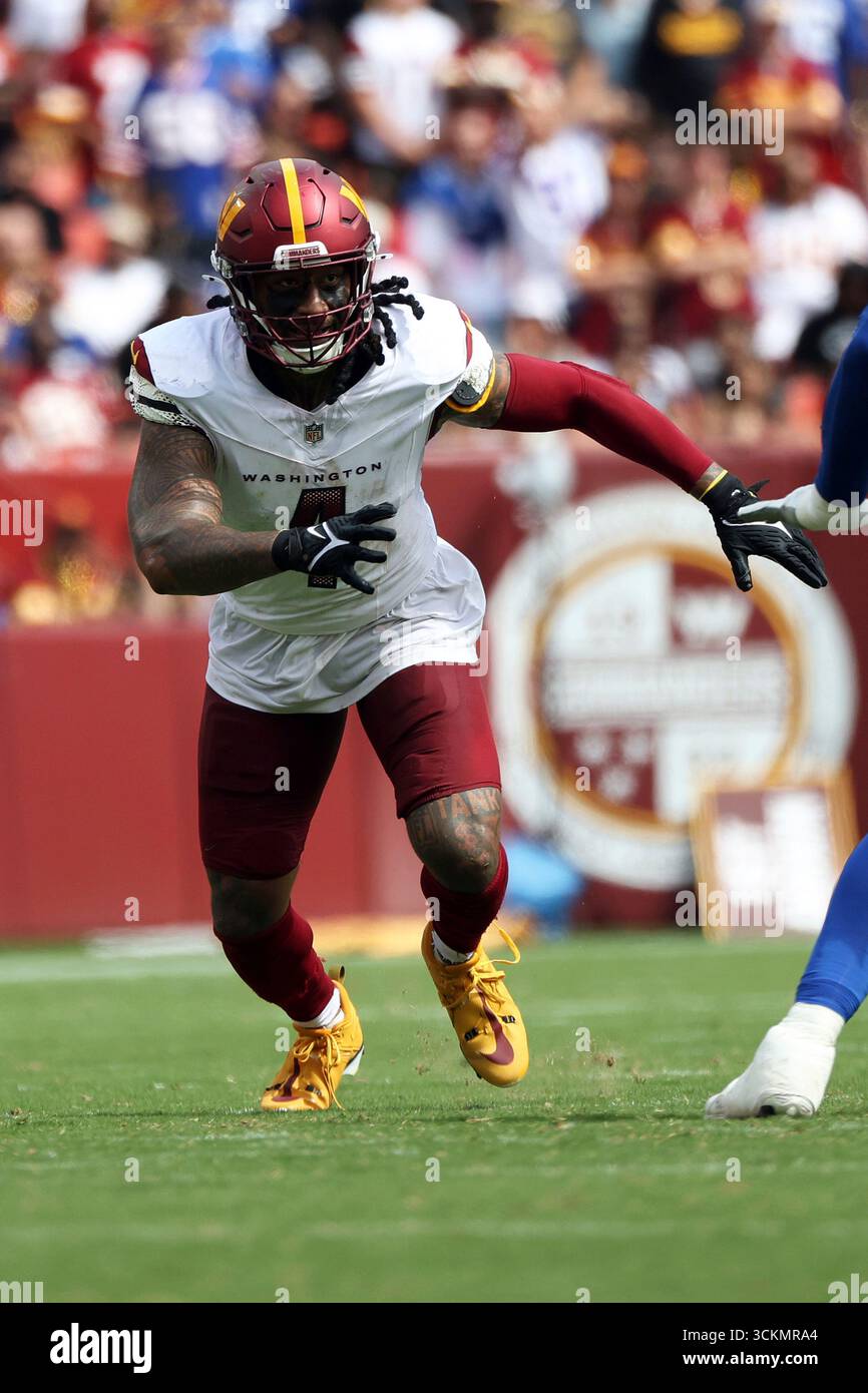 Washington Commanders linebacker Frankie Luvu (4) rushes during an NFL ...