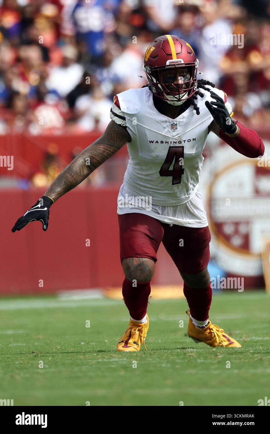 Washington Commanders linebacker Frankie Luvu (4) rushes during an NFL ...