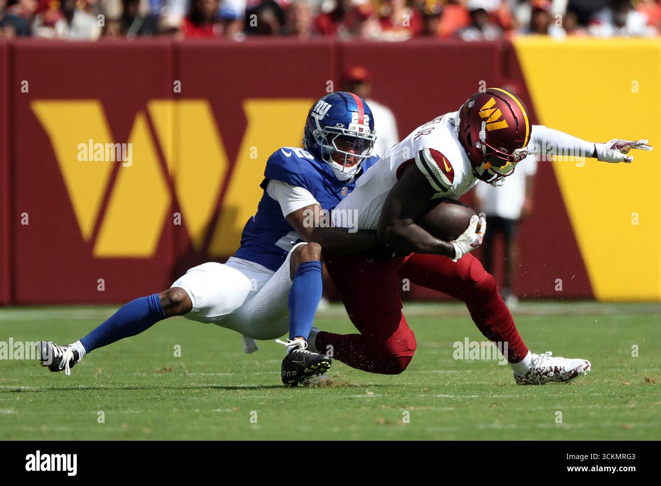 New York Giants cornerback Dru Phillips (22) takes down Washington ...