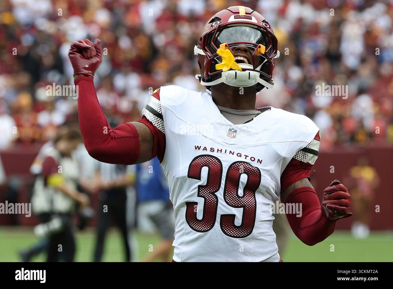 Washington Commanders safety Jeremy Reaves (39) celebrates before an ...