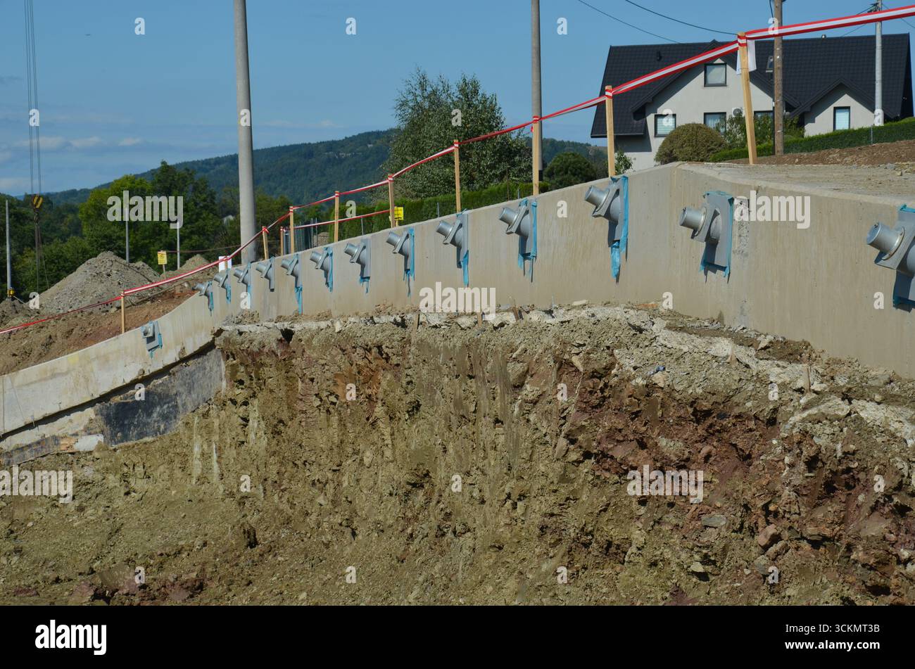 Construction site with ground stabilization works, including retaining ...