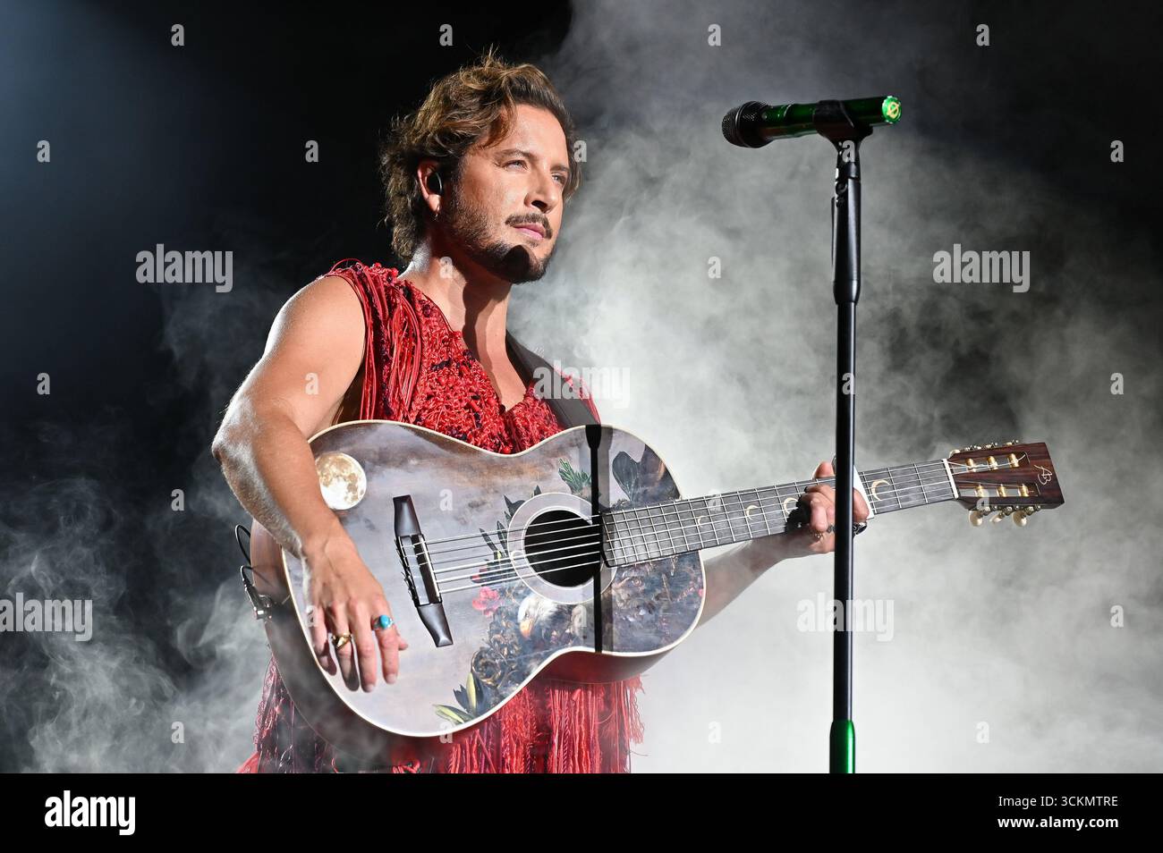 Spanish singer Manuel Carrasco, performs during the concert at Movistar ...