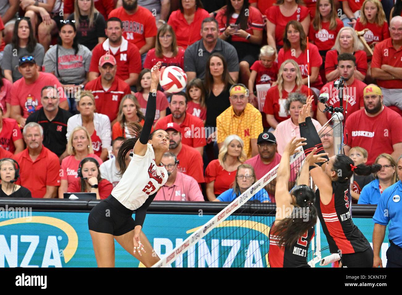 Nebraska's Harper Murray (27) spikes the ball against Utah during an ...