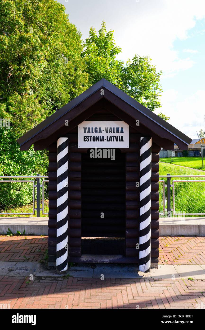 Traditional black and white wooden border guard house marking the open ...