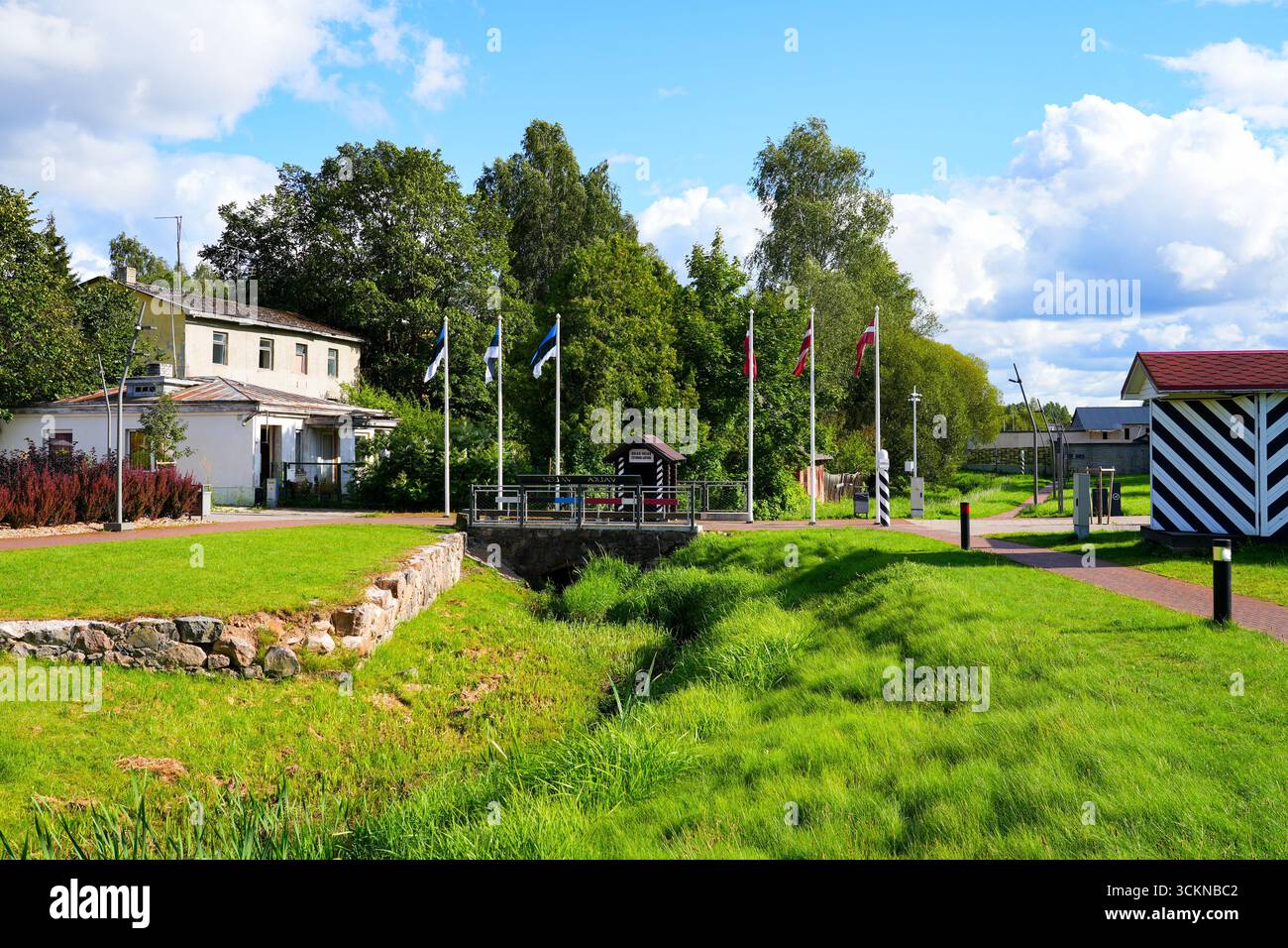Traditional black and white wooden border guard house marking the open ...