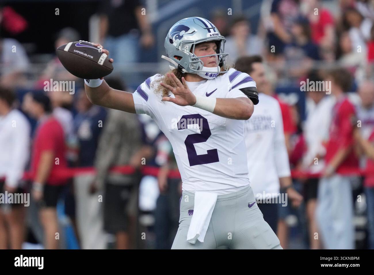 Kansas State quarterback Avery Johnson (2) warms up before an NCAA ...