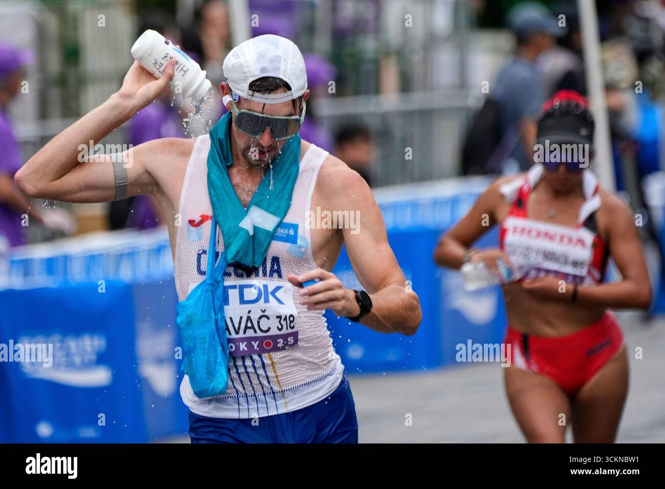 Czech Republic's Vit Hlavac cools off during the men's 35 kilometers ...