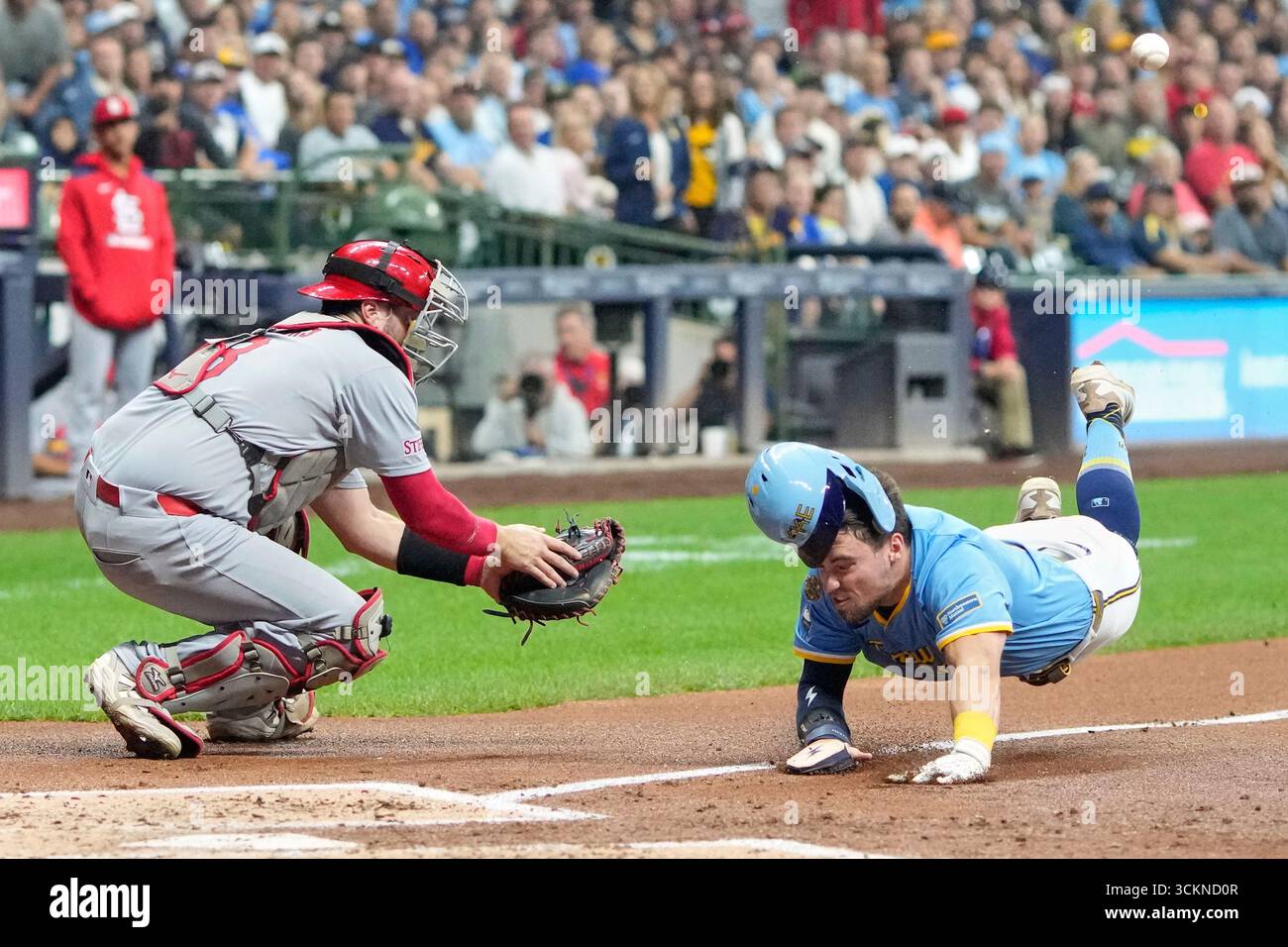 Milwaukee Brewers' Caleb Durbin scores past St. Louis Cardinals catcher ...