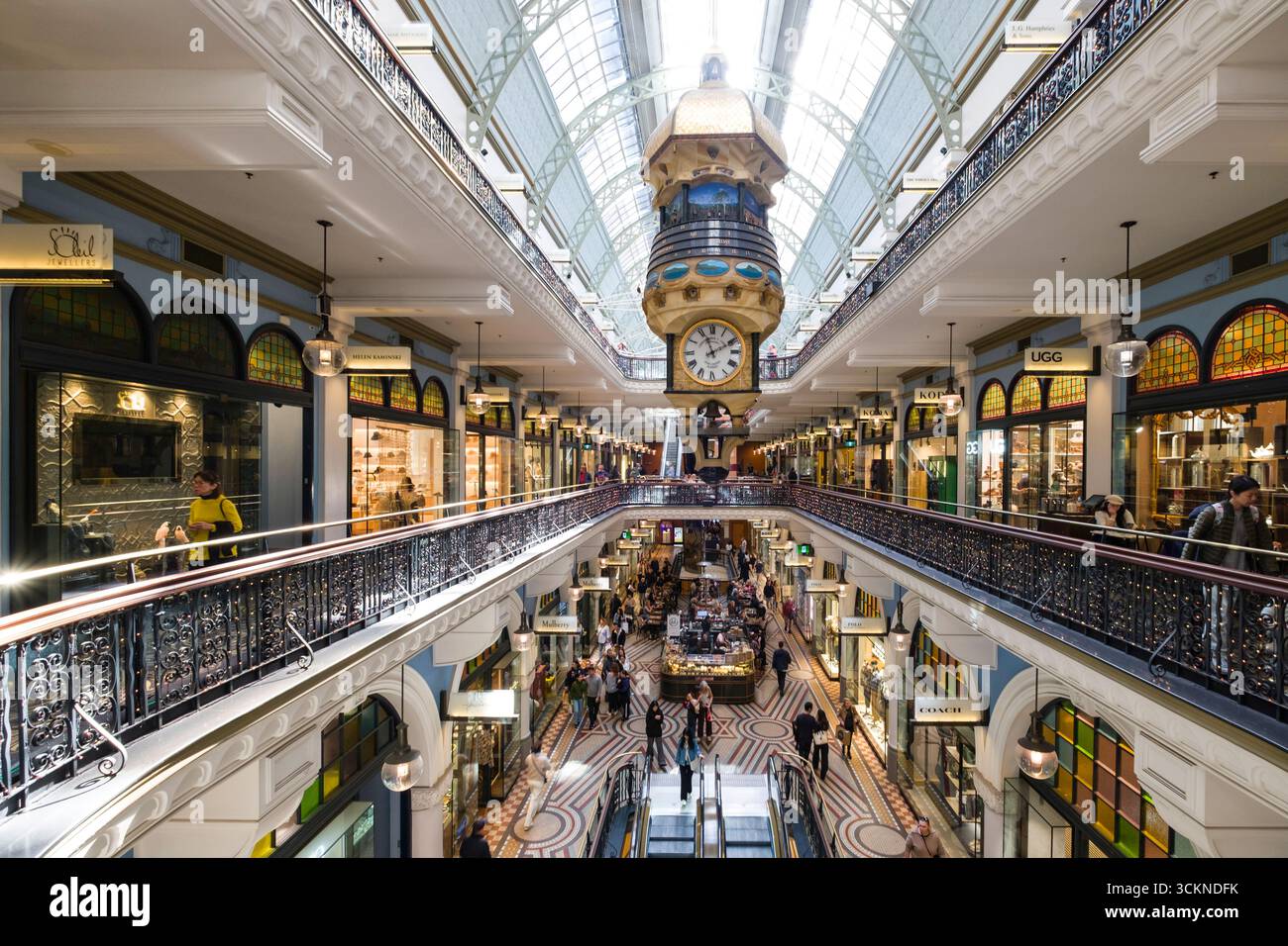 A spacious mall showcasing two levels of retail storefronts, a grand ...