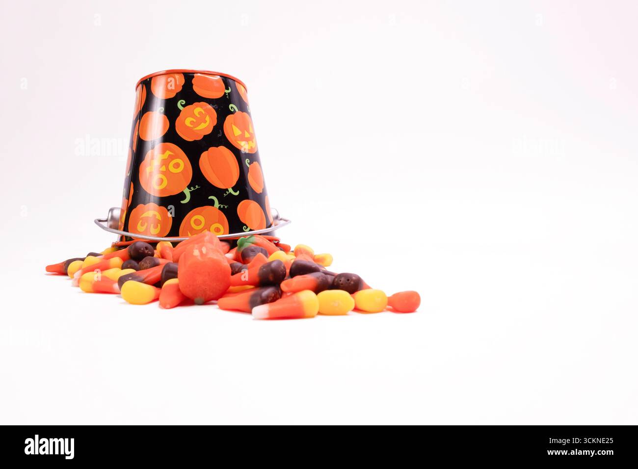 A bucket of halloween candy turned upside down with all the candy ...