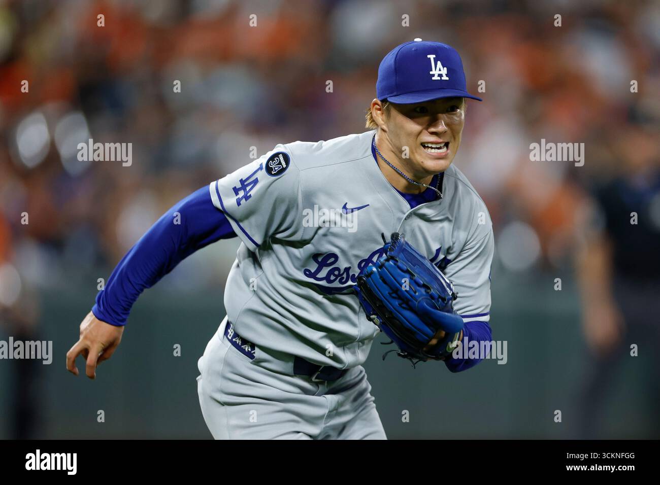 Yoshinobu Yamamoto #18 of the Los Angeles Dodgers runs to tag first ...