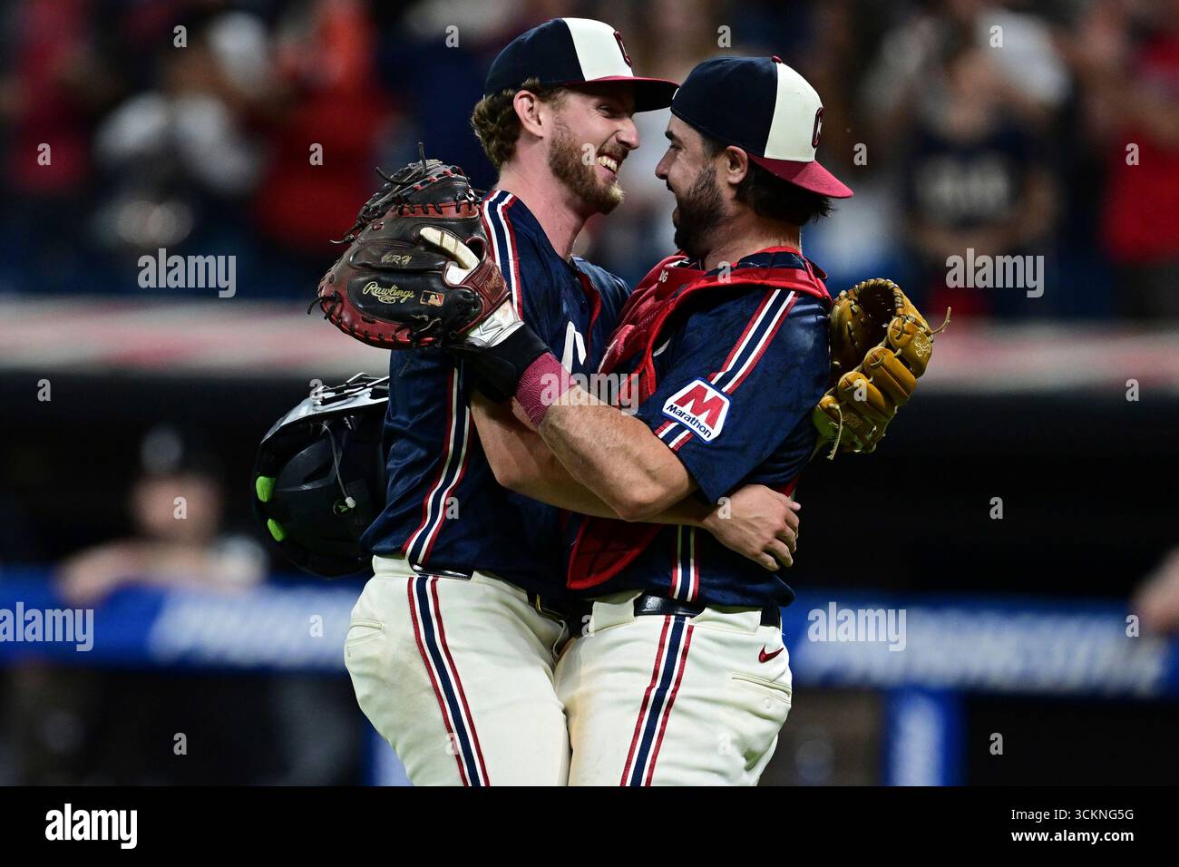 Cleveland Guardians starting pitcher Tanner Bibee, left, is ...