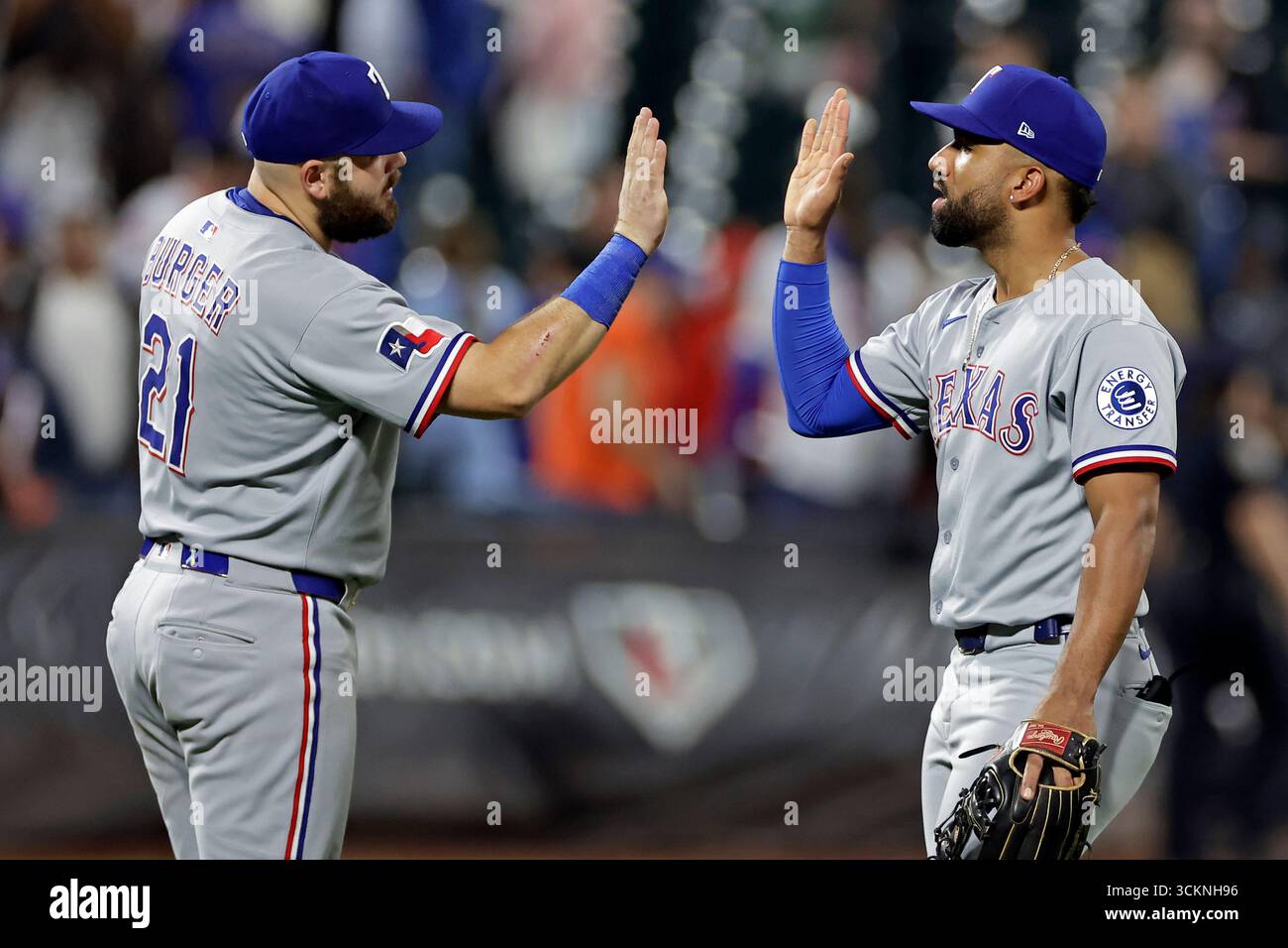 Texas Rangers first base Jake Burger (21) and Ezequiel Duran high-five ...