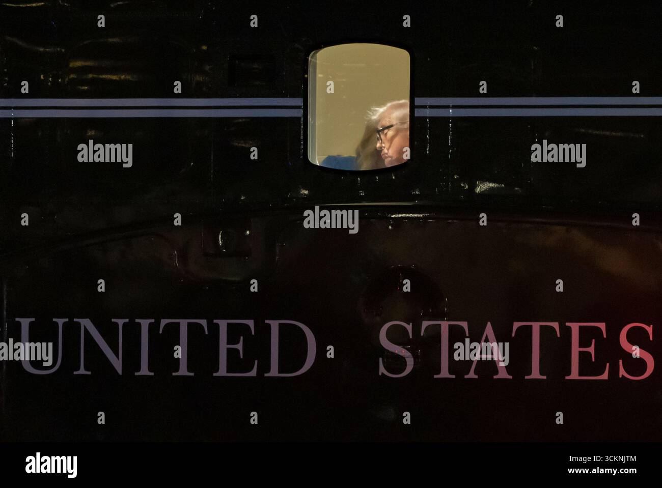 President Donald Trump is seen through a window as he departs on Marine ...