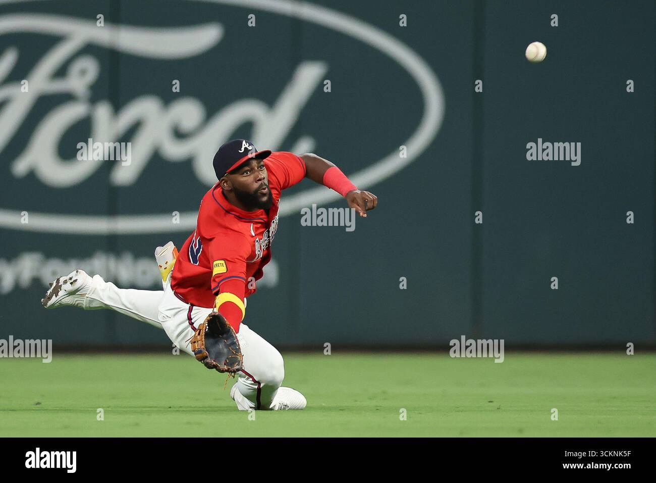 Atlanta Braves outfielder Michael Harris II tries to catch a fly ball ...