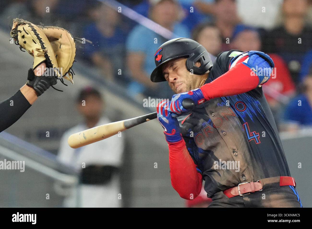 Toronto Blue Jays' George Springer (4) leans away from an inside pitch ...