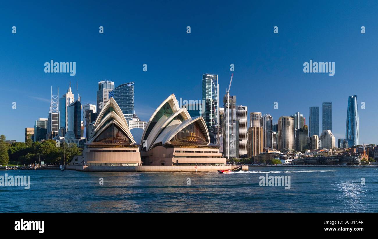 A stunning view of the Sydney Opera House in front of the modern ...