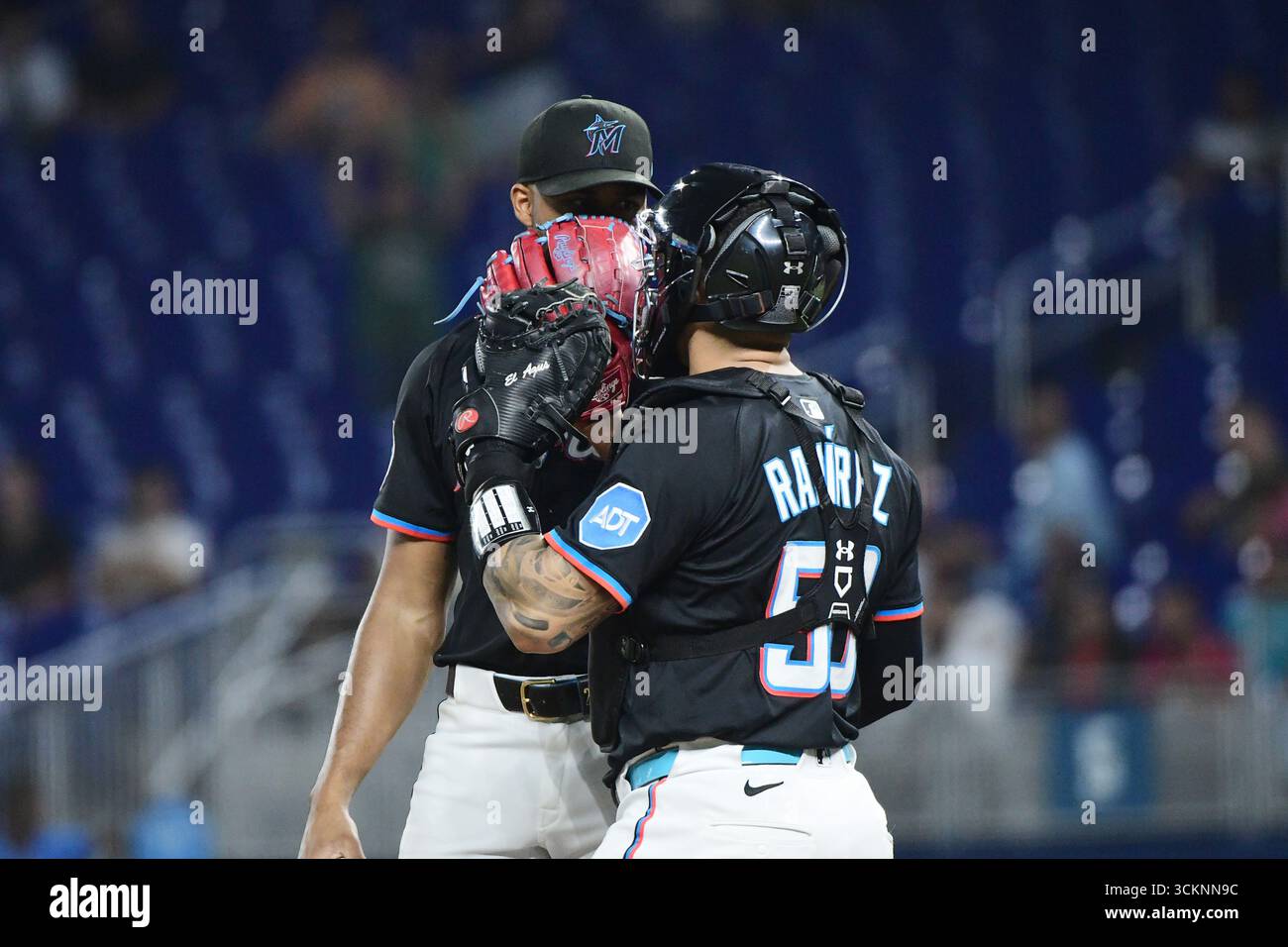 Miami Marlins starting pitcher Sandy Alcantara (22) talks with Miami ...