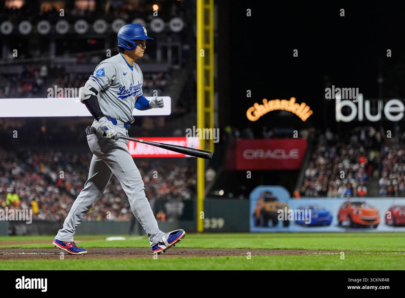 Los Angeles Dodgers' Shohei Ohtani makes his way to first after being ...