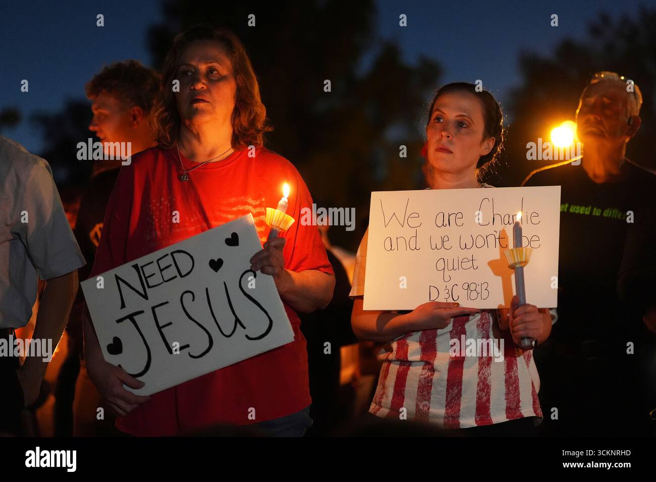 Lisa Hill, left, and Natalie stand during a vigil for Charlie Kirk on ...