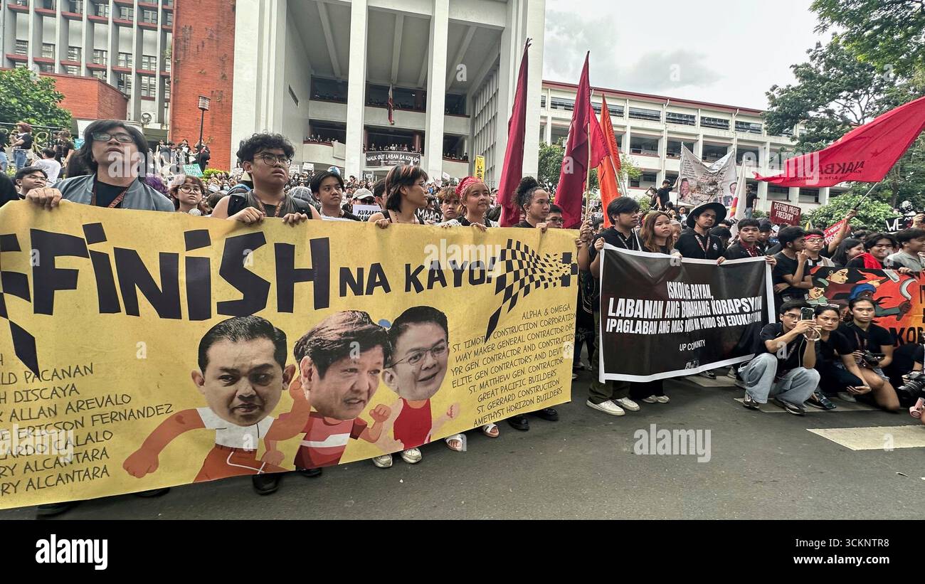 FILE - Hundreds of students at the University of the Philippines walk ...