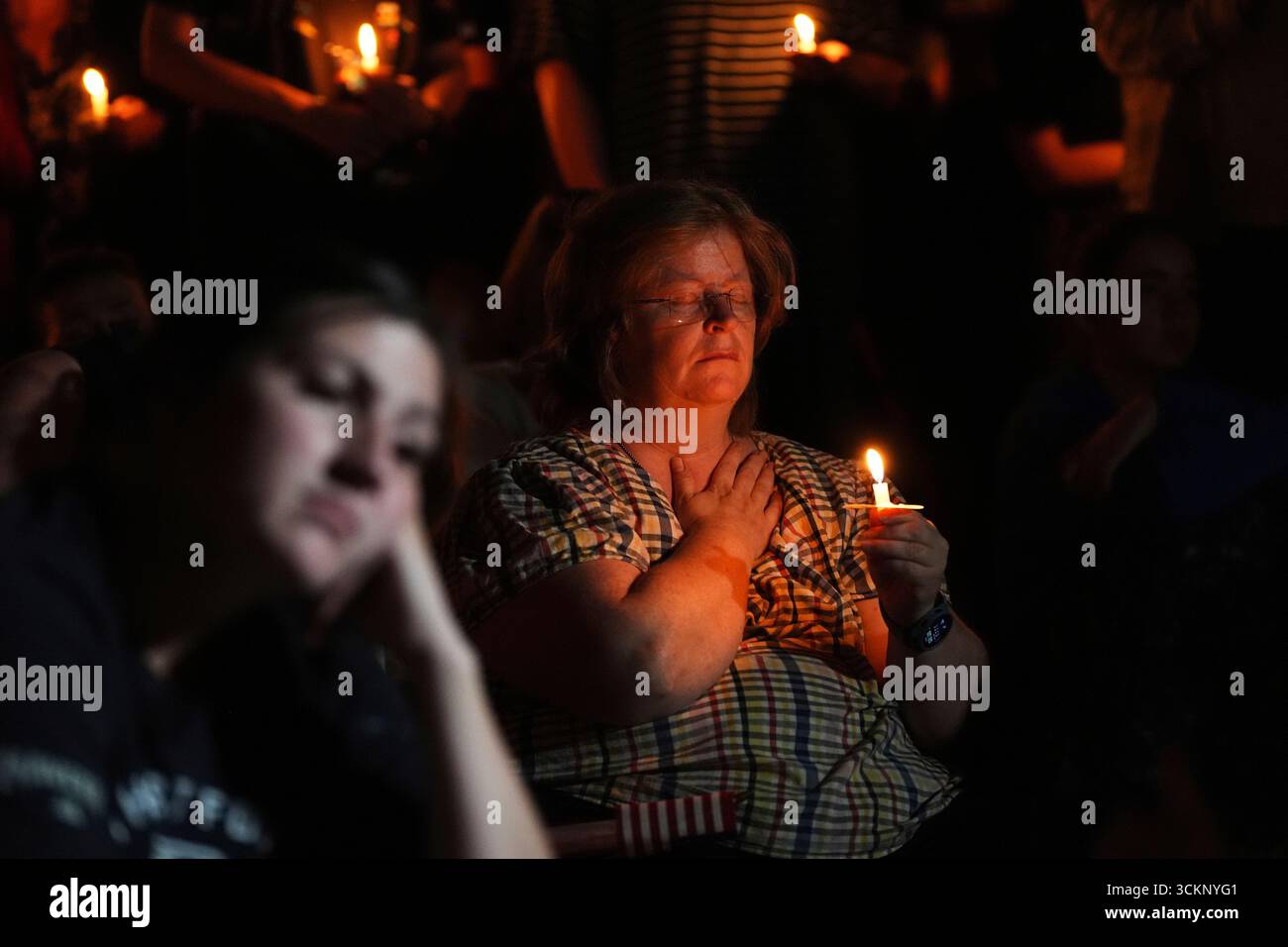 Ginger Keller pays her respects during a vigil for Charlie Kirk on ...
