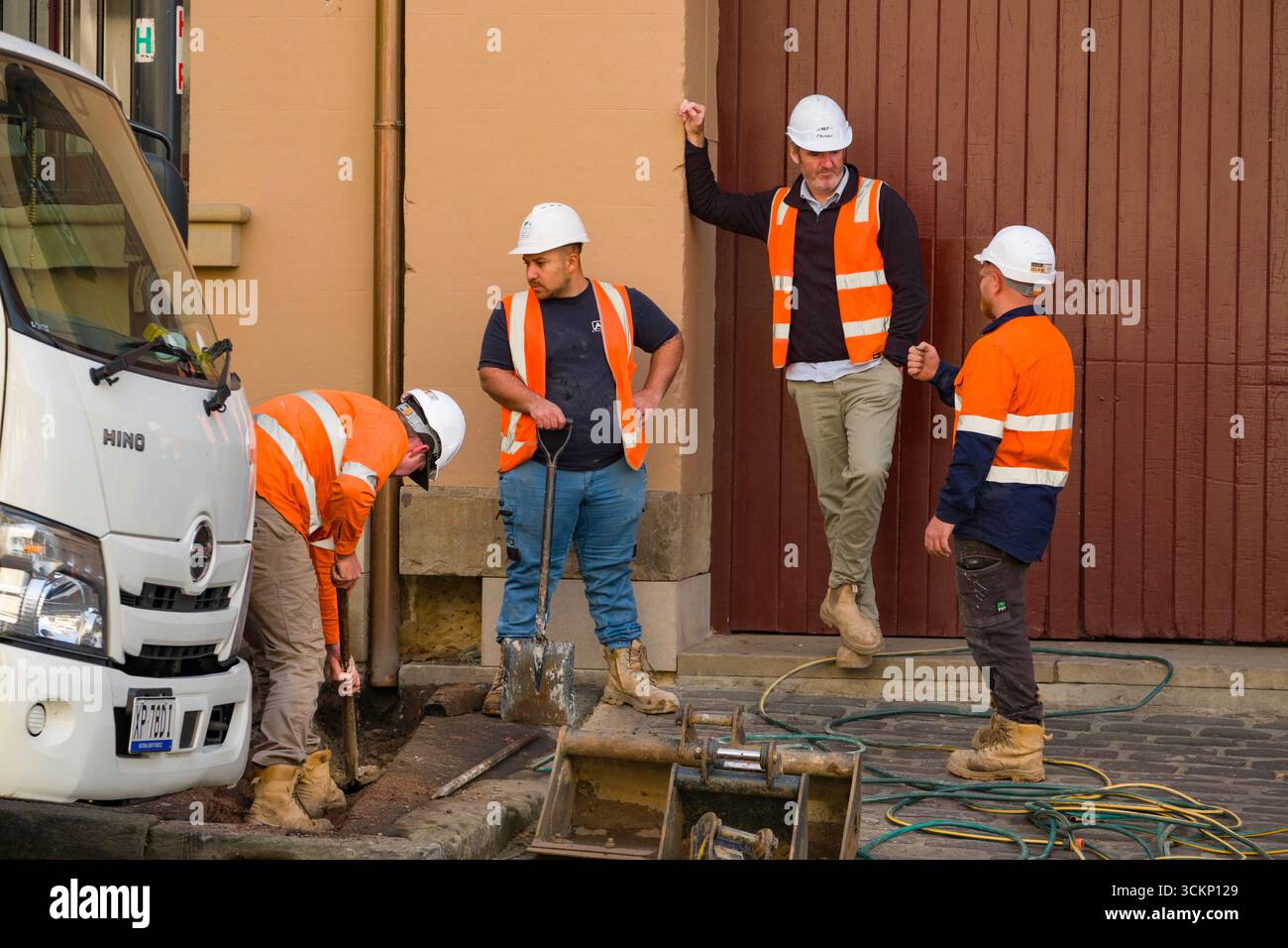 Construction workers wearing orange hi-res stock photography and images ...