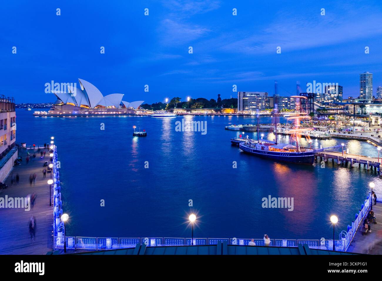 Stunning view of Sydney Opera House and harbor beautifully illuminated ...