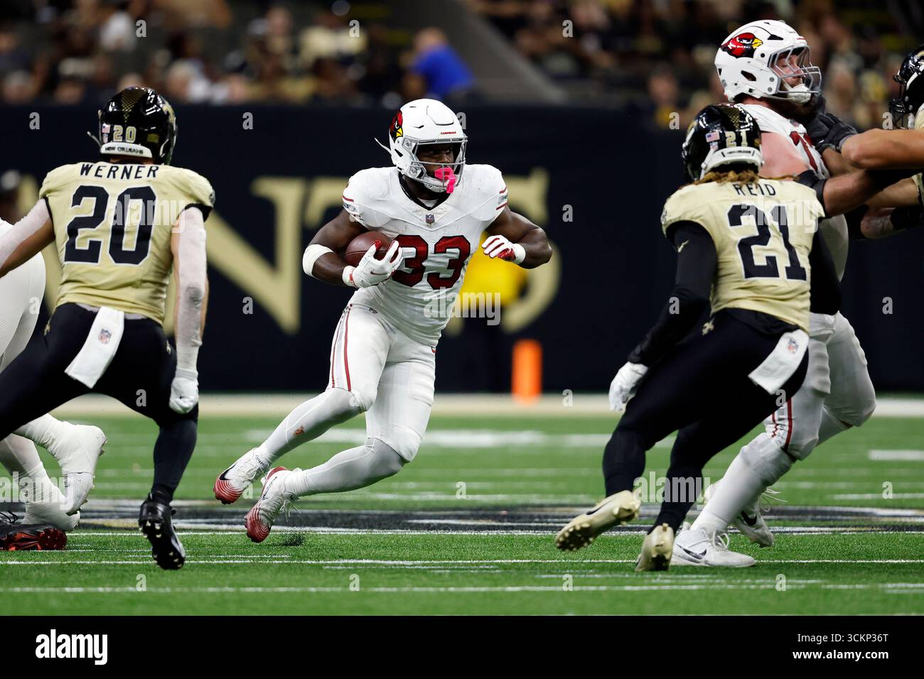 Arizona Cardinals running back Trey Benson (33) runs the ball during an ...