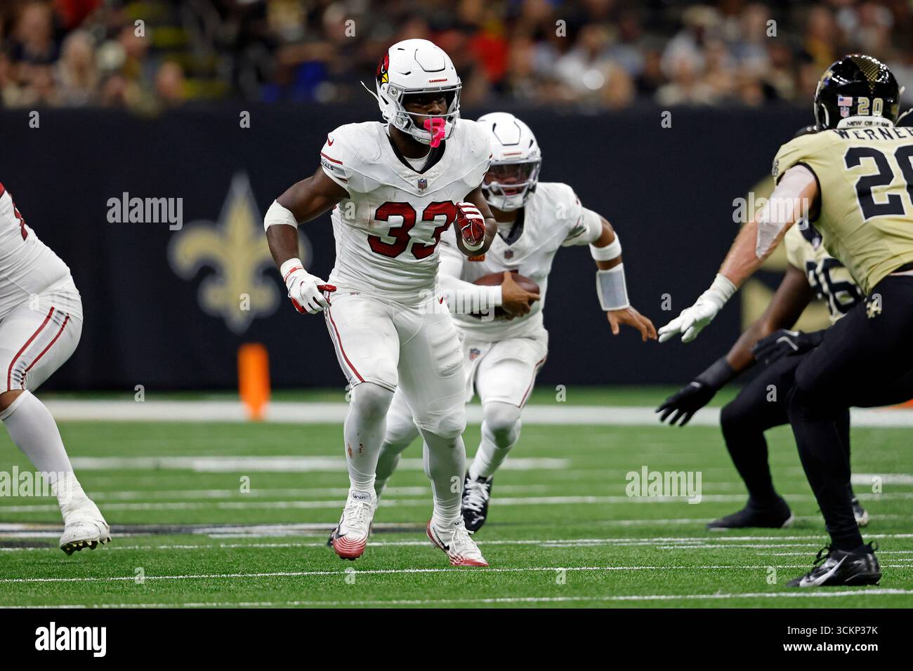 Arizona Cardinals running back Trey Benson (33) runs a route during an ...