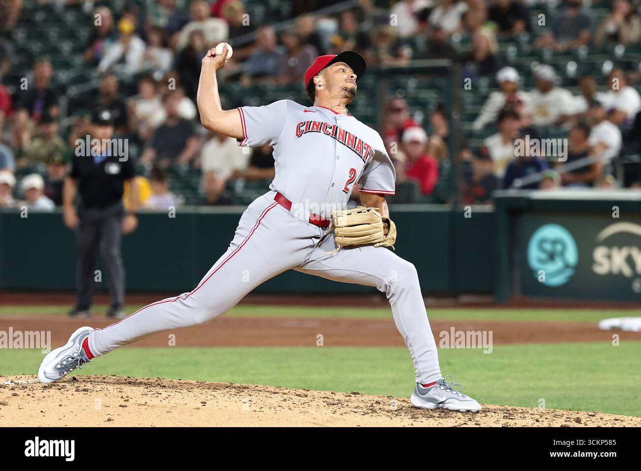 Cincinnati Reds pitcher Chase Burns throws to the Athletics during the ...