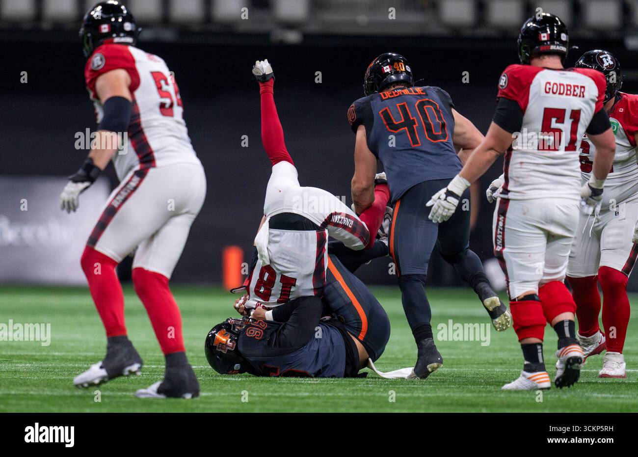 Ottawa Redblacks quarterback Dustin Crum (18) gets tackled by B.C ...