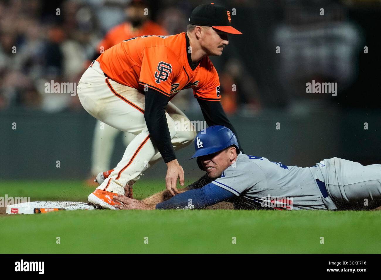Los Angeles Dodgers' Ben Rortvedt, right, is tagged out at third by San ...