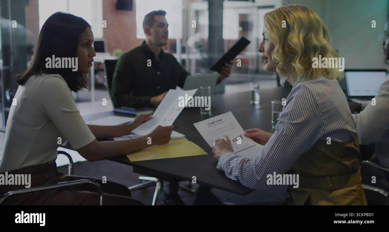 Reviewing printed reports four hi-res stock photography and images - Alamy