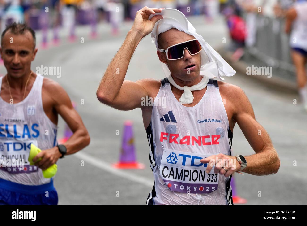 France's Kevin Campion grimaces as he competes in the women's 35 ...