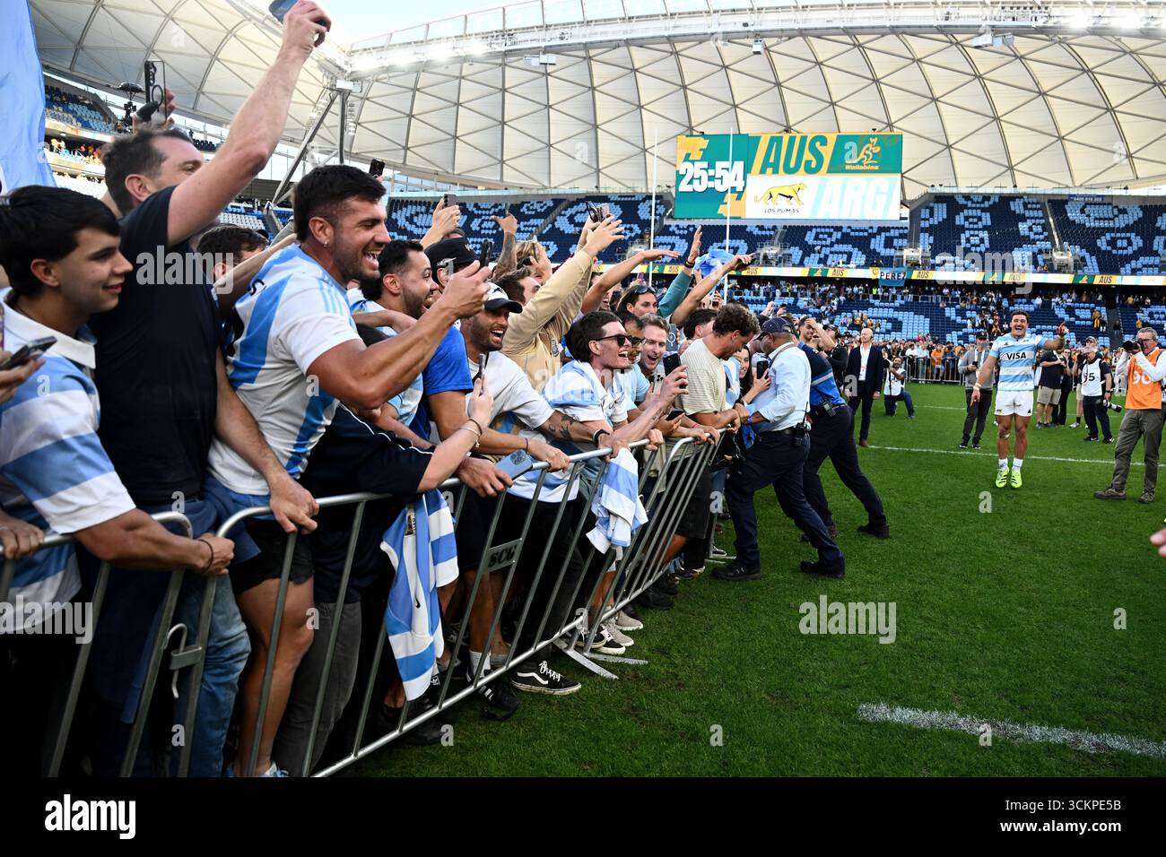 Allianz stadium staff hold fences back as Argentina fans celebrate ...