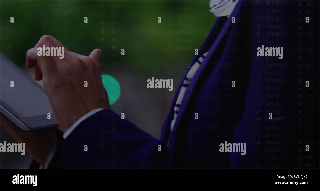 Holding professional wearing suit jacket tapping tablet screen at park ...