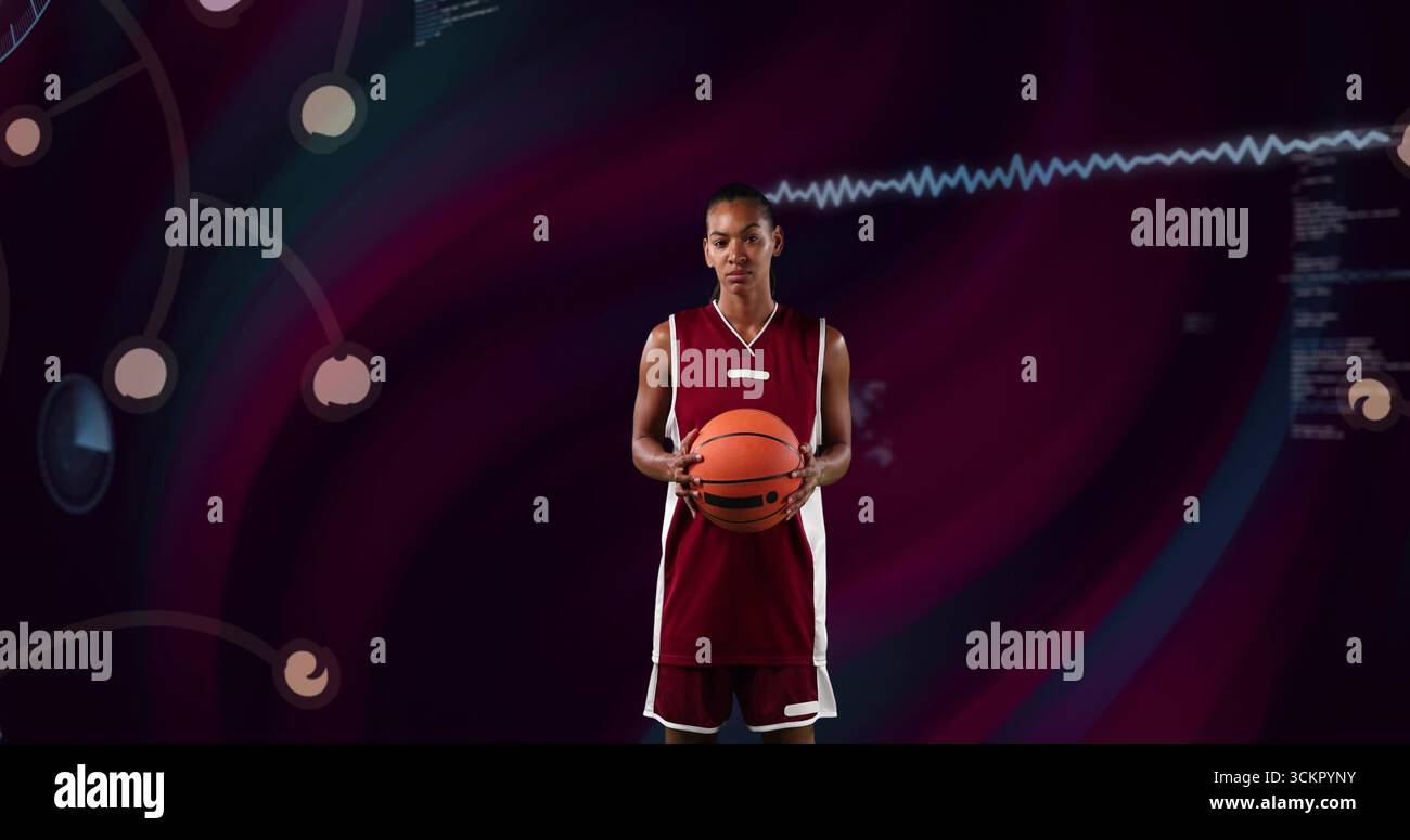 Standing female basketball player wearing crimson and white jersey in ...